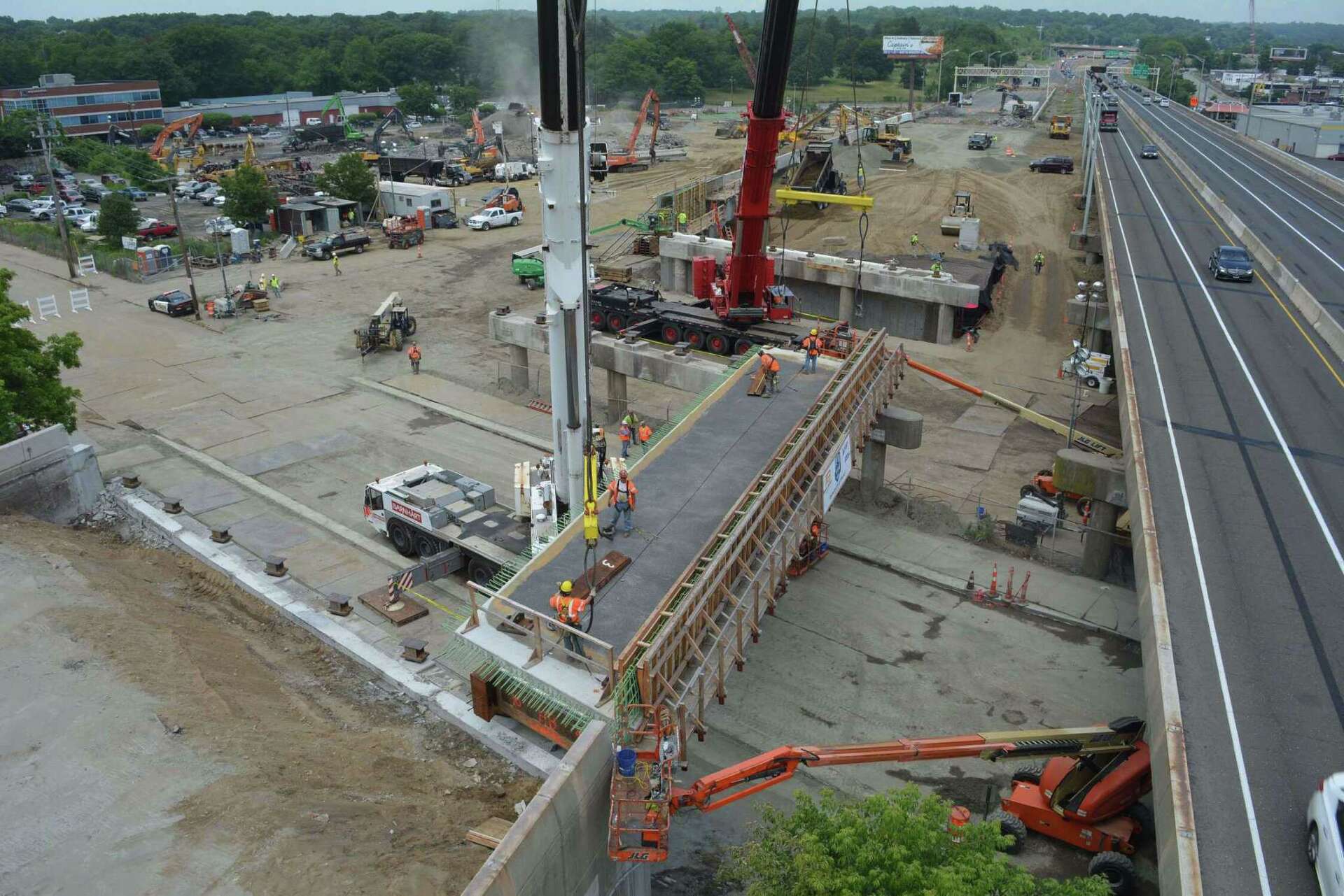 Photos: Workers put last pieces on new Route 8/25 bridge