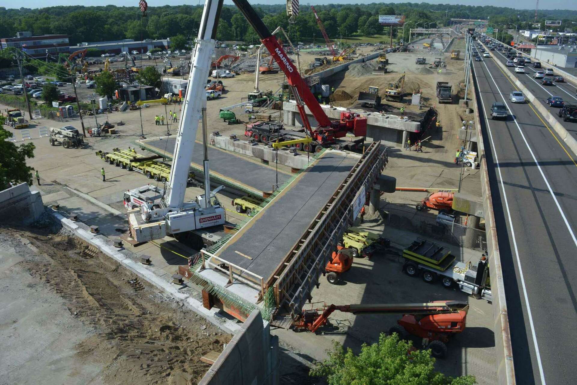 Photos: Workers put last pieces on new Route 8/25 bridge