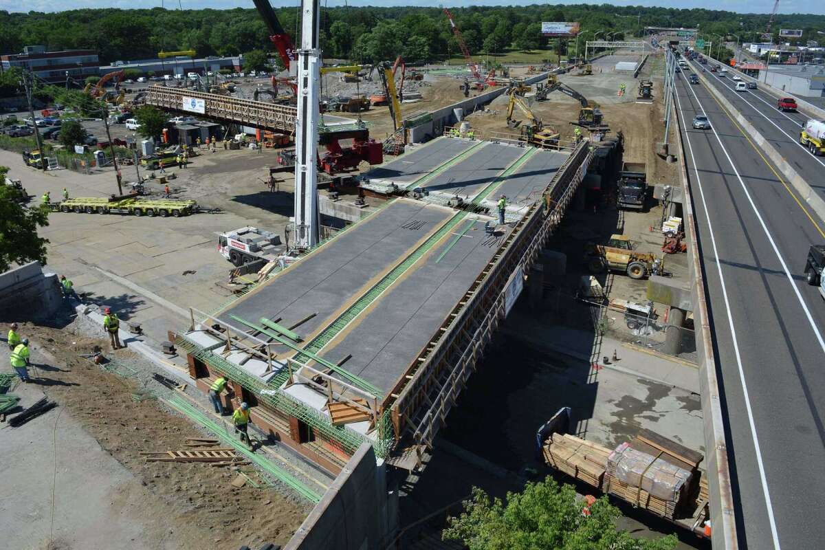 Photos: Workers put last pieces on new Route 8/25 bridge