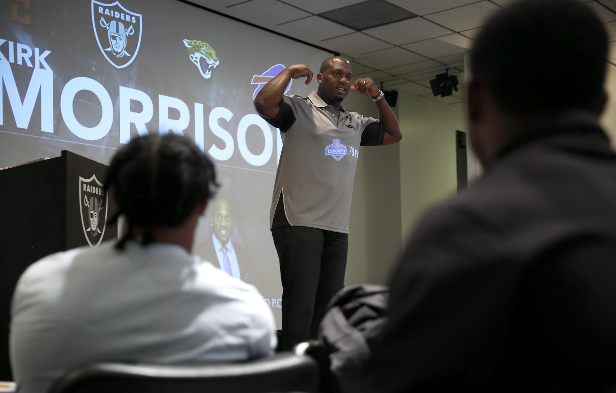 Kirk Morrison comforts his dad, who bleeds silver and black