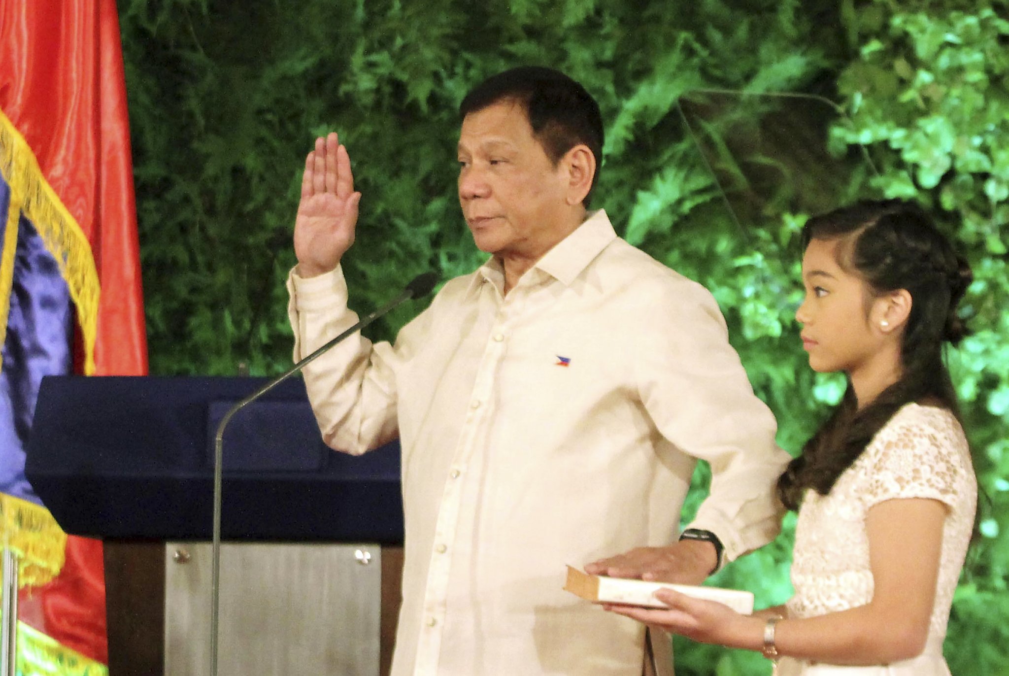 Hope and fear as combative president takes over Philippines
