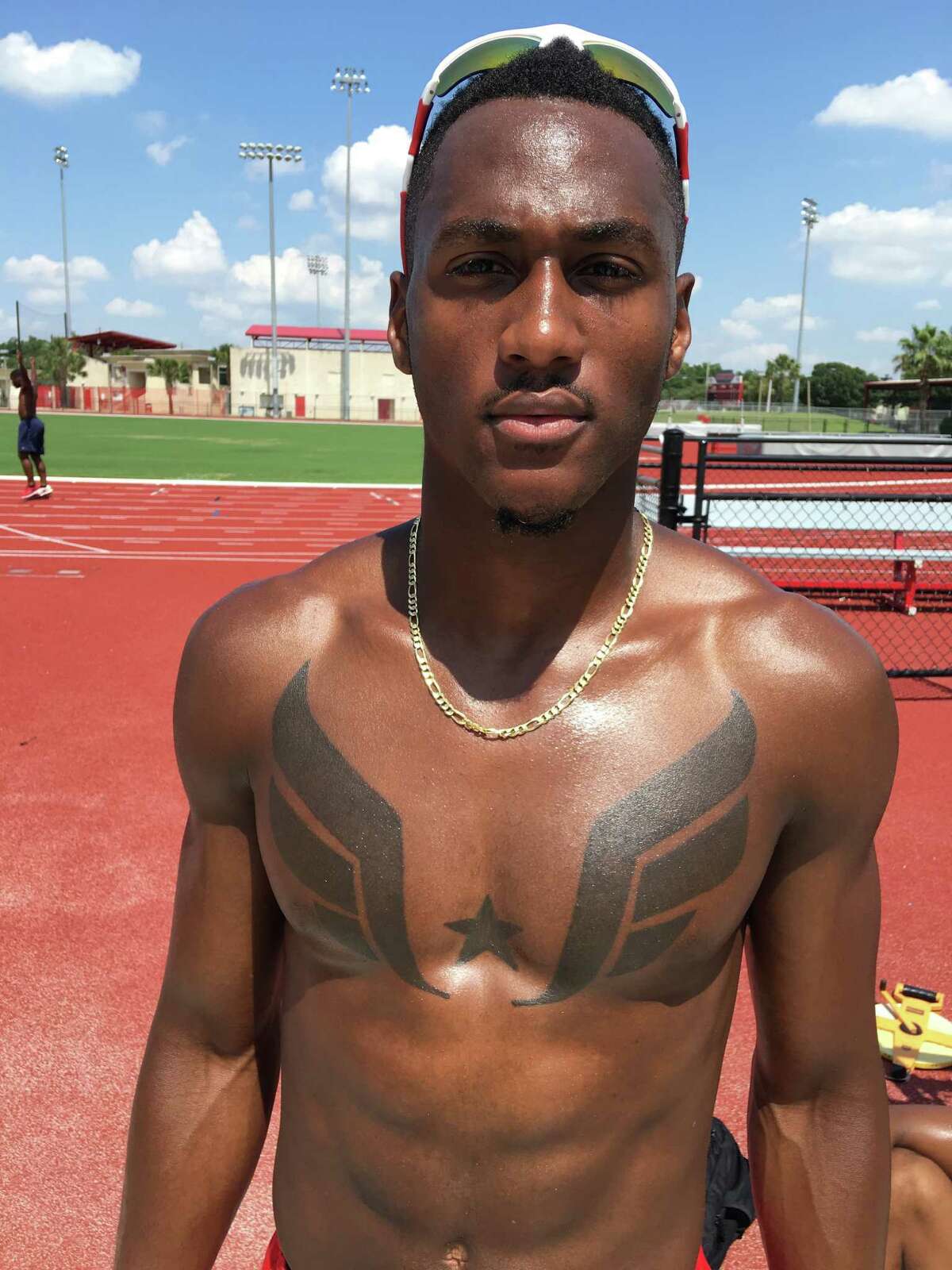 Track And Field Wings Tattoo