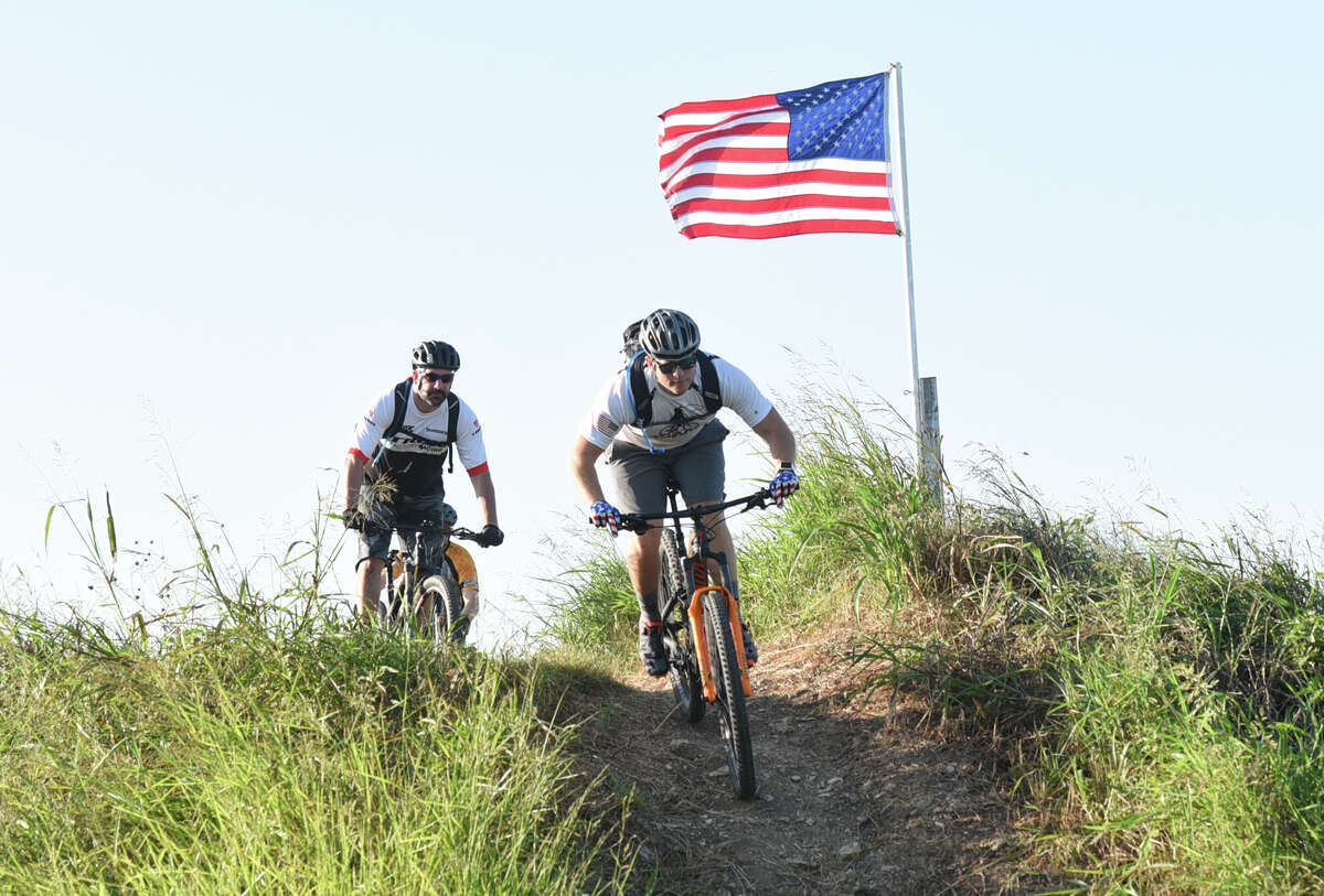 George W. Bush bicycles with wounded veterans in Texas on 70th birthday