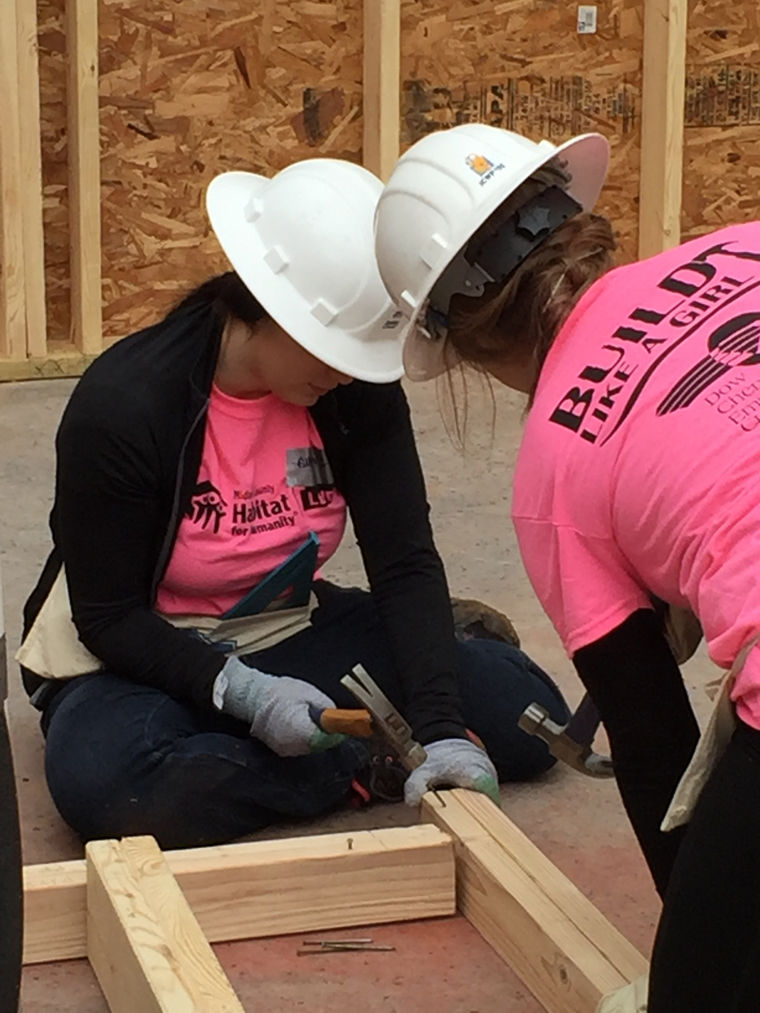 DCECU staff grab a hammer at Habitat build
