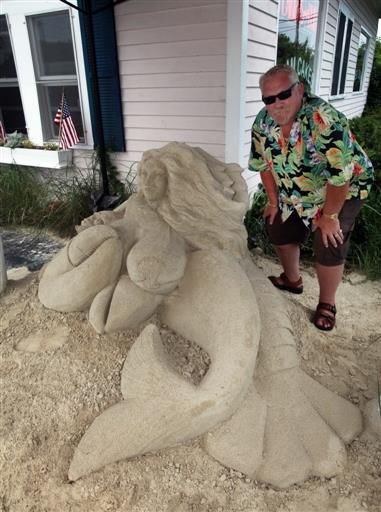 Sand sculpture of busty Cape Cod mermaid draws complaints