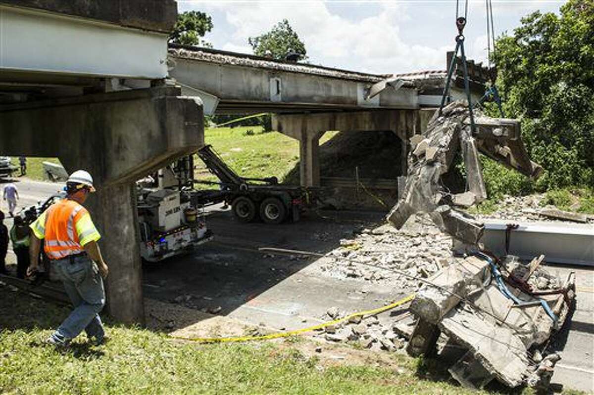 Truck hits Texas bridge, debris strikes car, killing child