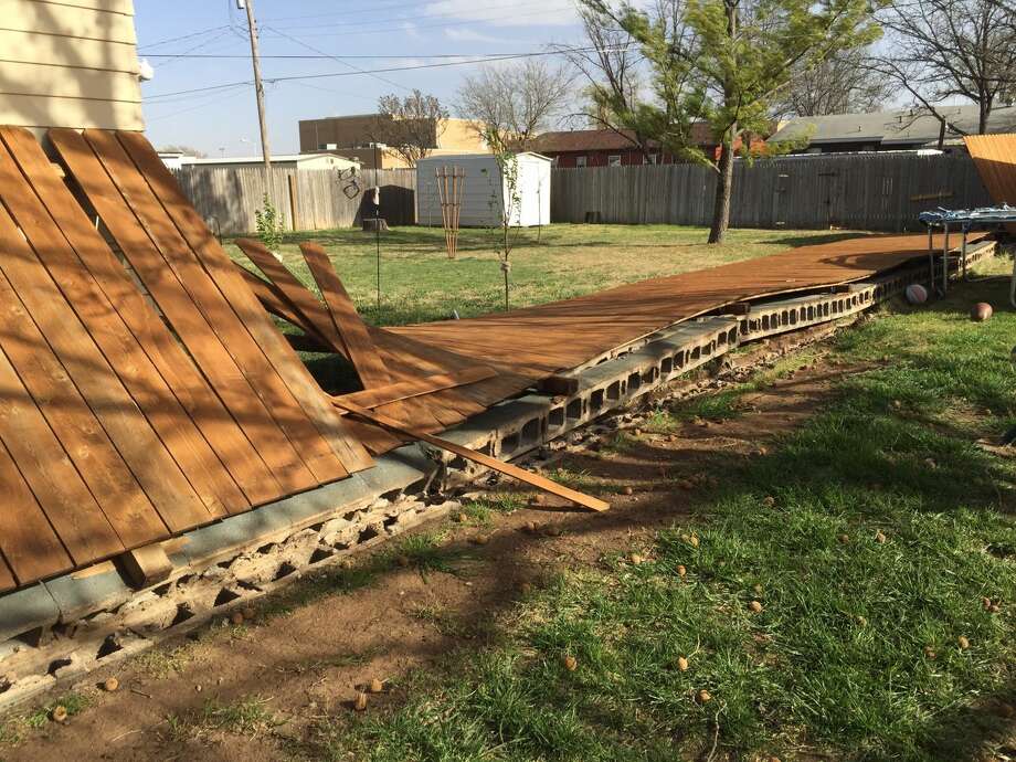 Winds blow down concrete fence - Plainview Herald