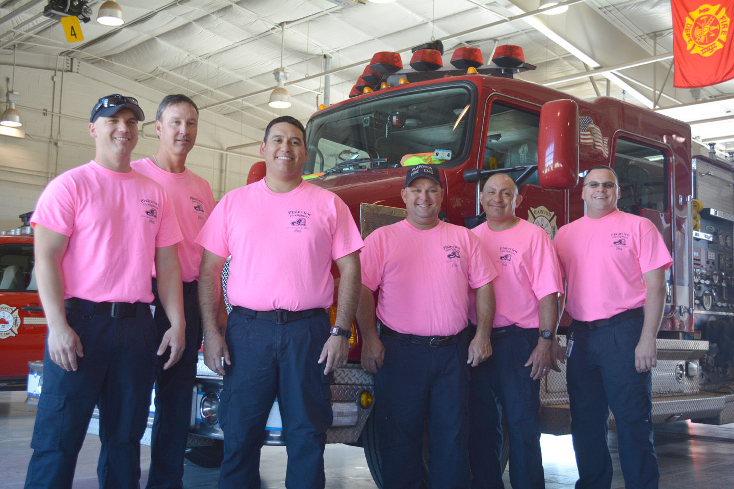 Local firefighters wearing pink