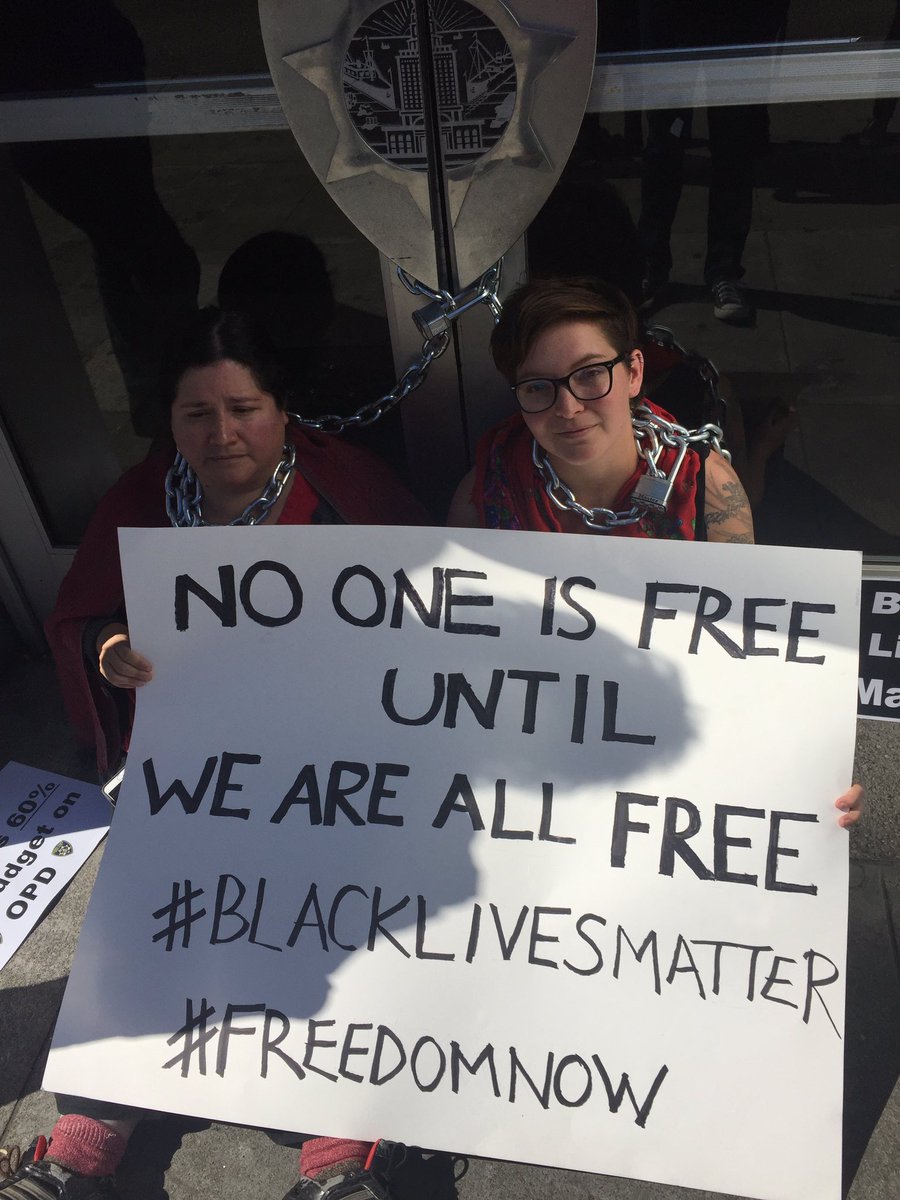 Protesters chain selves to door at Oakland police headquarters