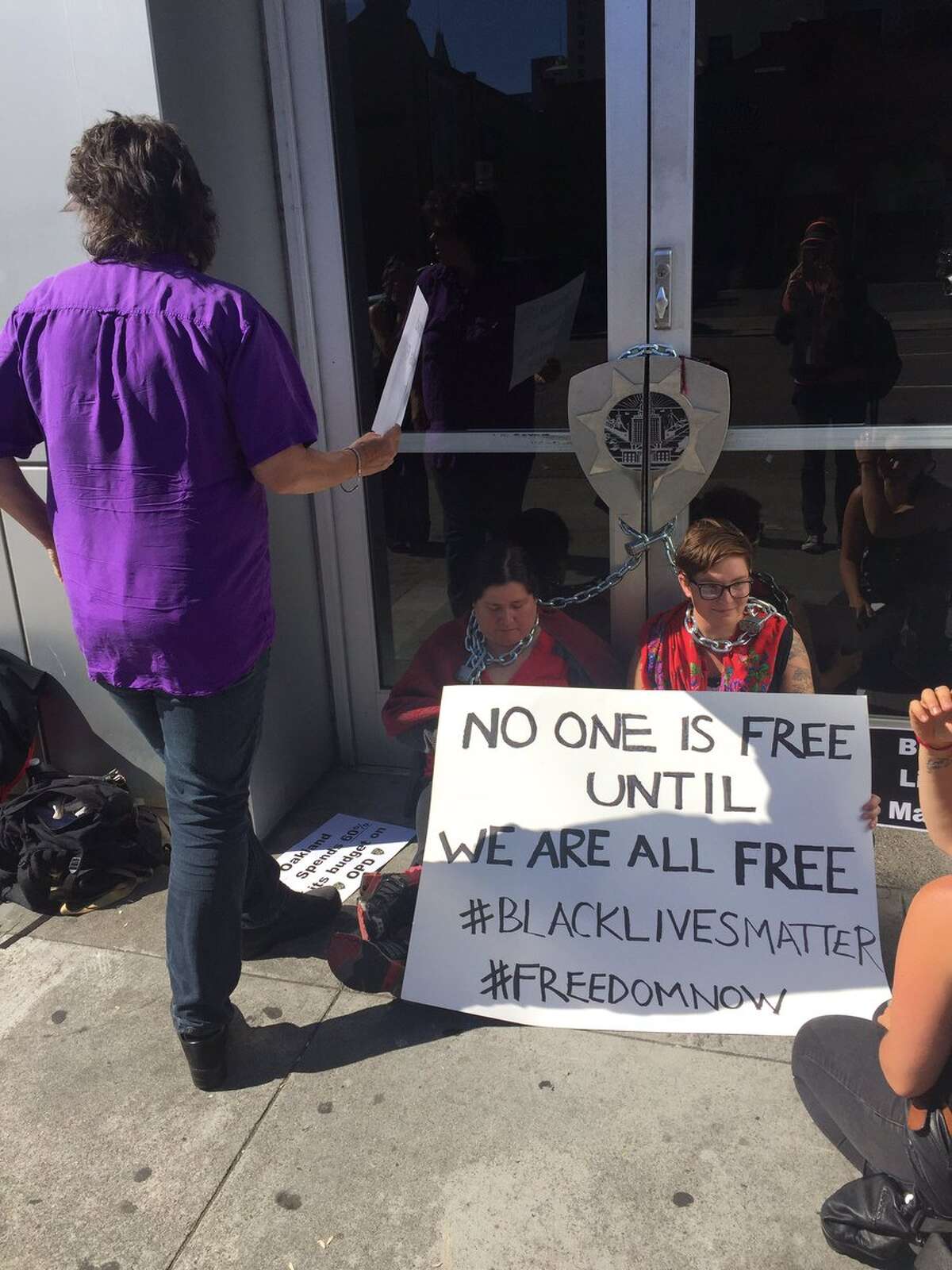 Protesters chain selves to door at Oakland police headquarters