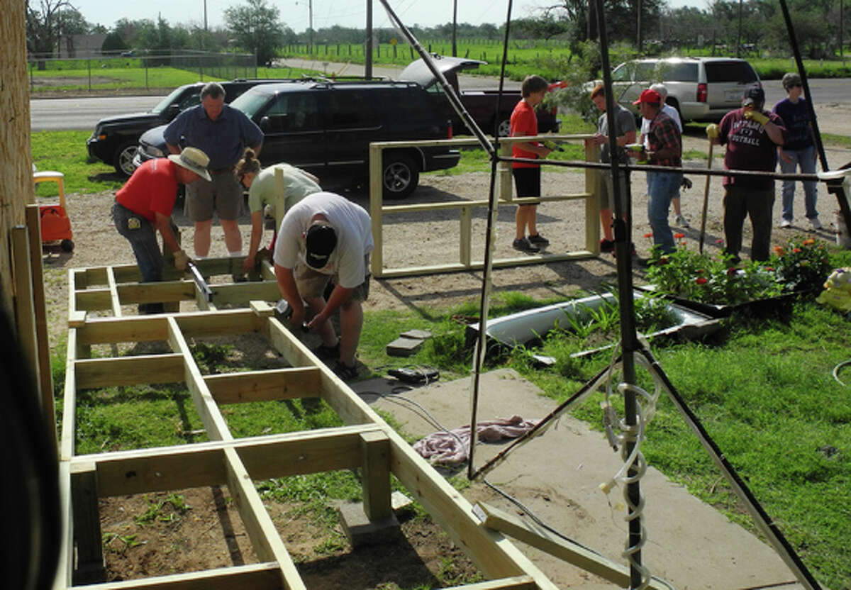 Volunteers build ramp for Plainview citizen