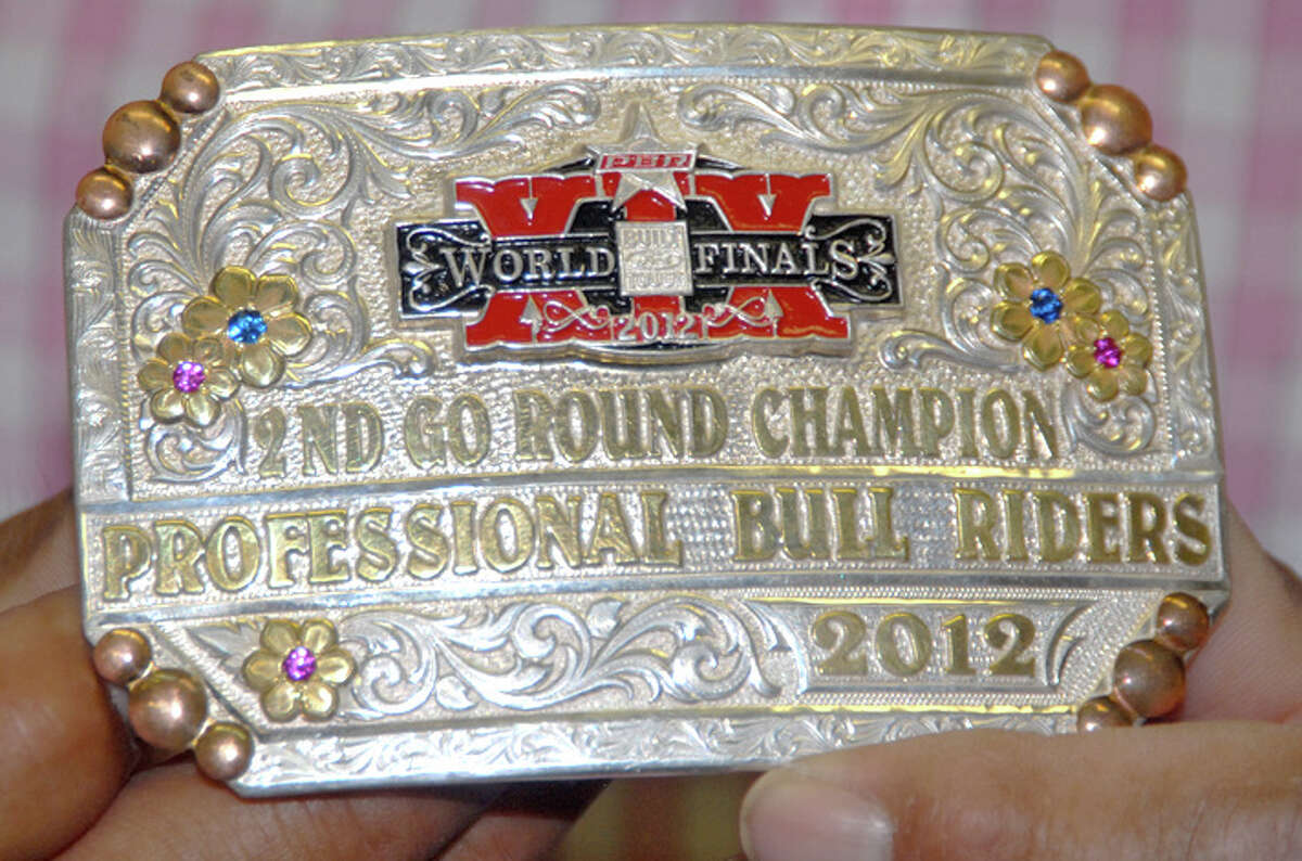 Cirildo Leal gets prized buckle from PBR champ