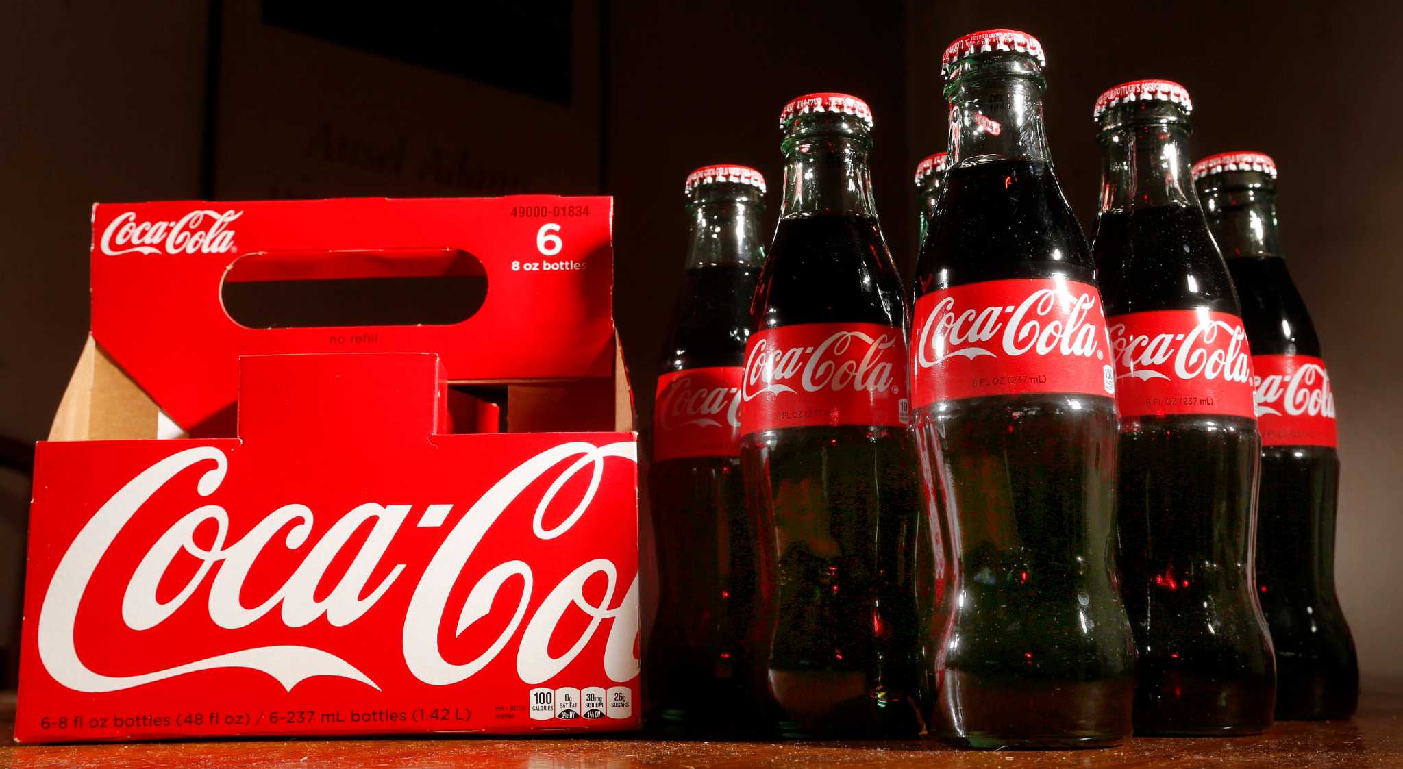 Coca-Cola cuts sales outlook amid weak international demand