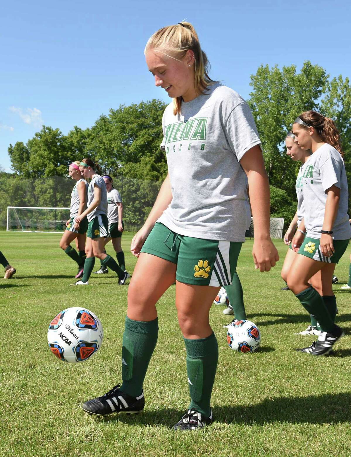 Summer vacation: Siena soccer player lends assist to kids