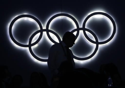The Latest: Italian pursuit team replaces Russia in cycling