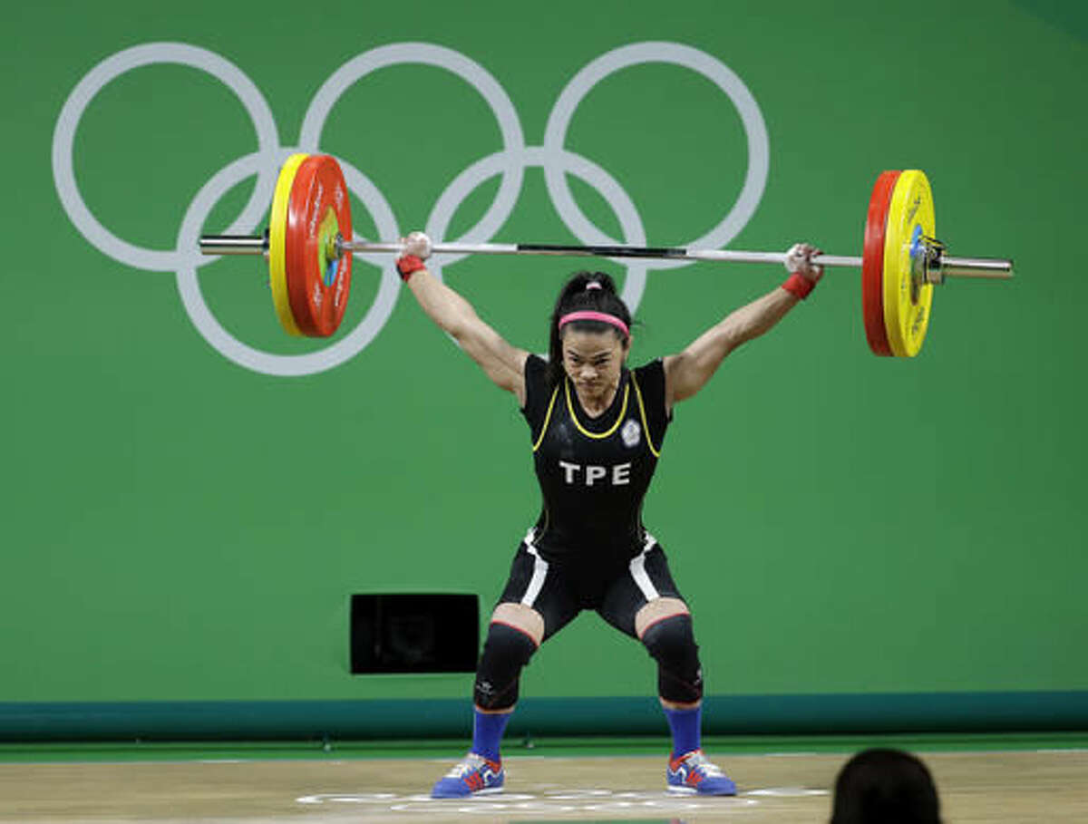 Long sets world record in winning Olympic weightlifting gold
