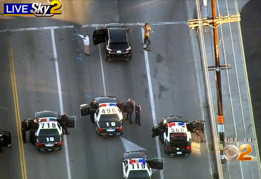 Los Angeles police detain 2 in investigation of armed men