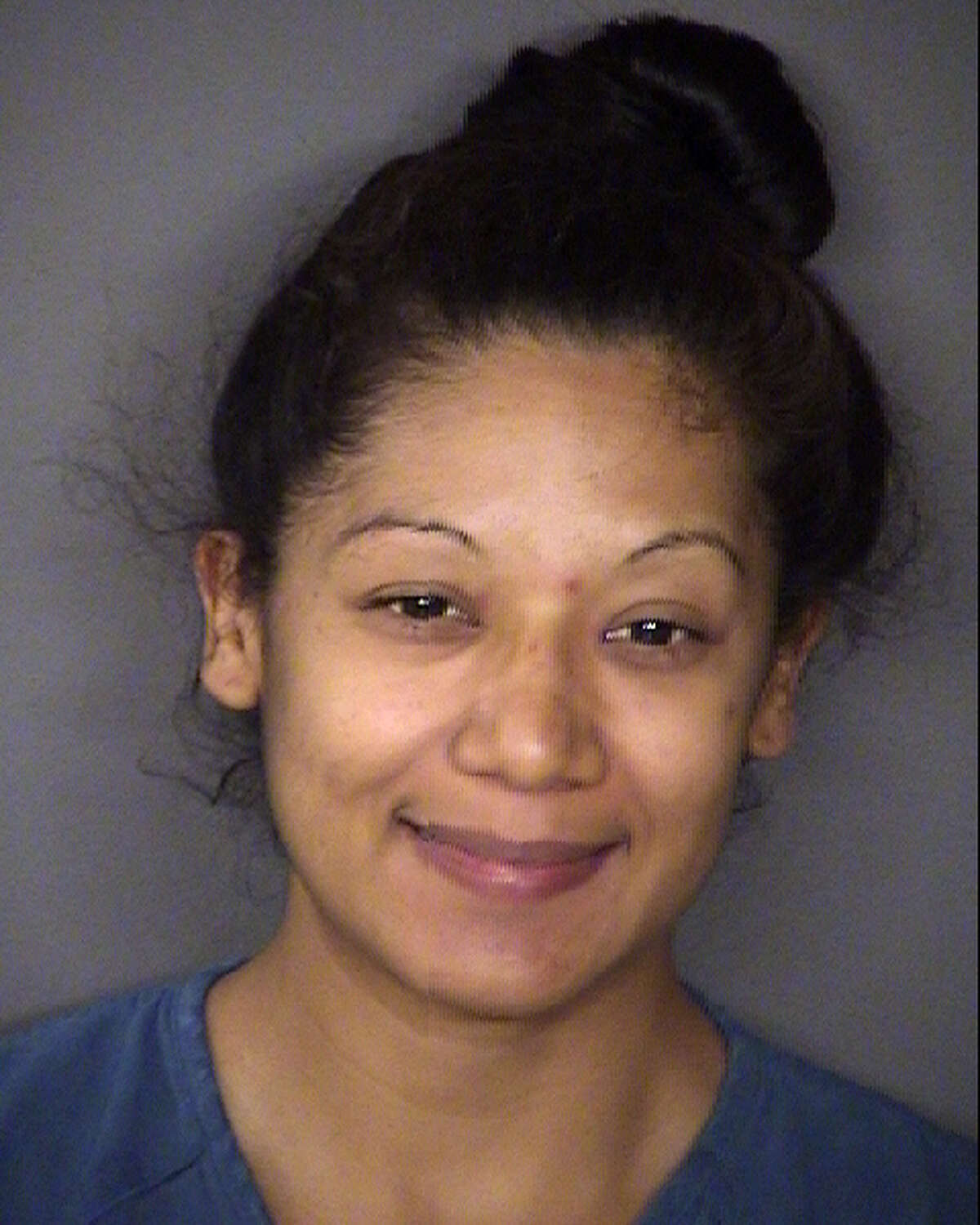 Woman arrested in connection to SW Side shooting smiles in mug, police ...