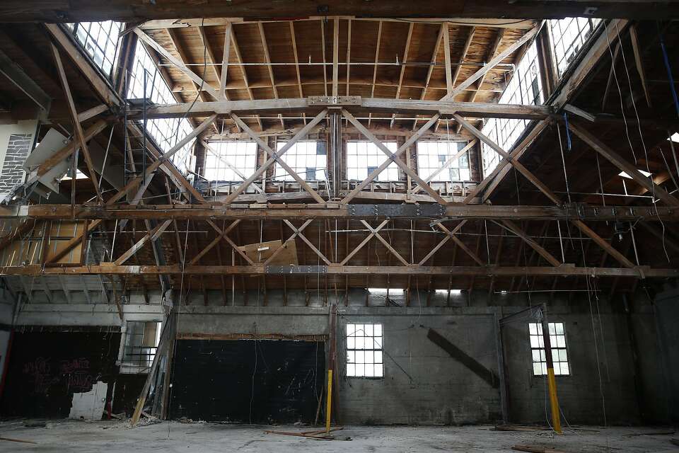 Firm transforms distressed Oakland buildings for well-off tenants