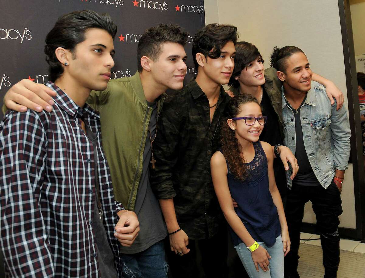 Latino boy band CNCO draws hundreds at Macy's in Houston