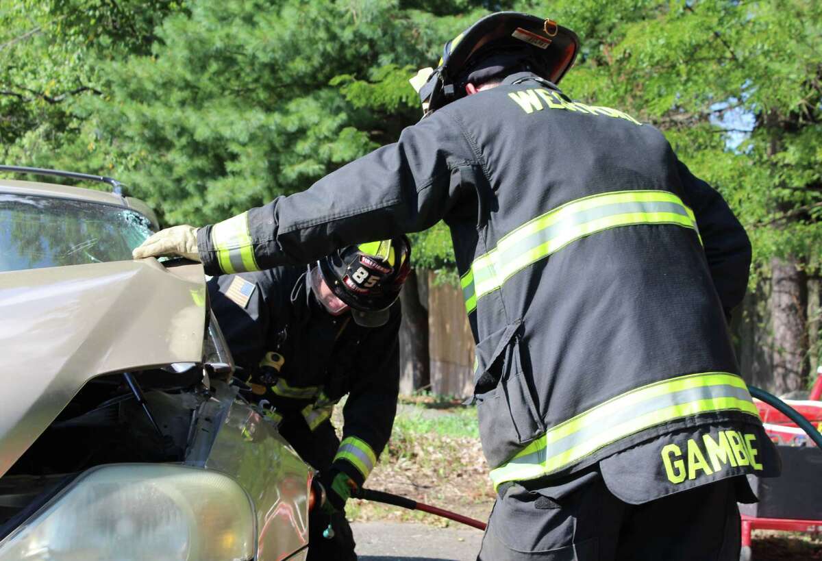 Firefighters practice car accident rescues