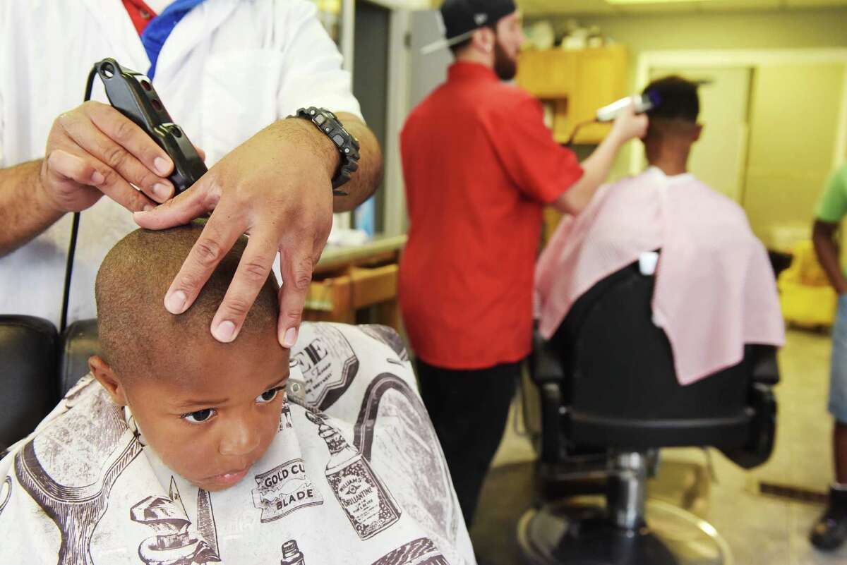 Photos: Kids get free haircuts