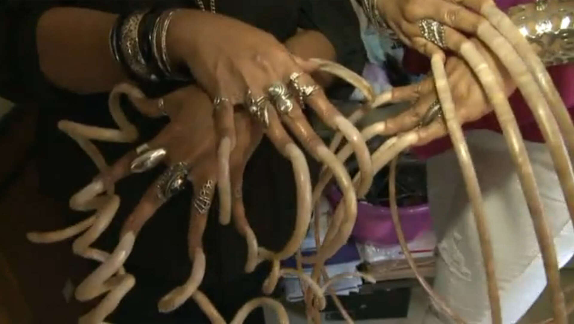 Houstonian grows fingernails to a remarkable 20 inches after 20 years