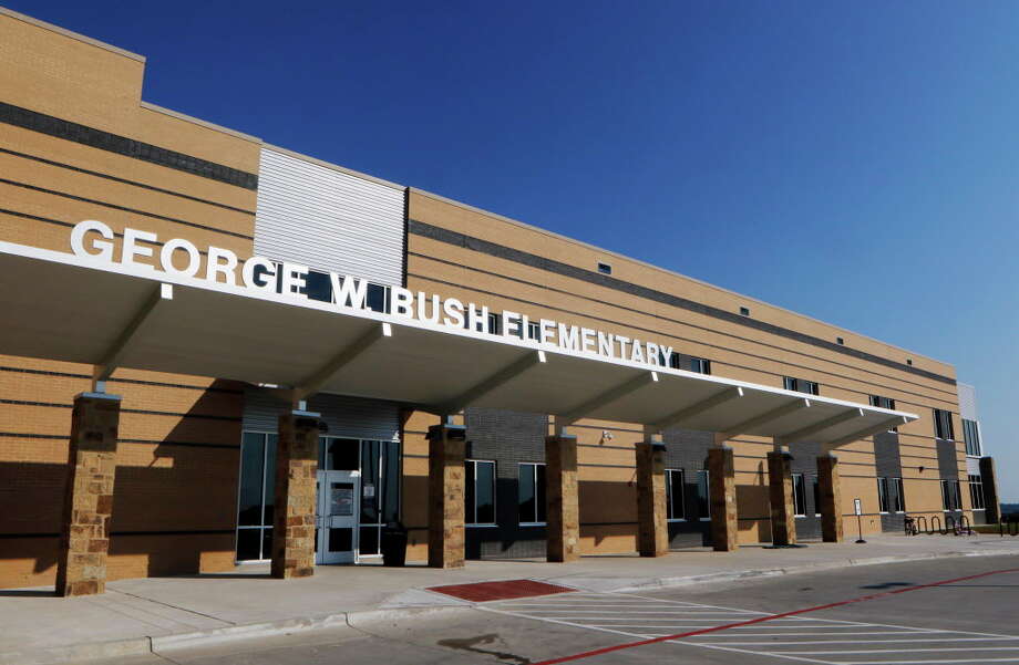 Former President George W. Bush visits the new elementary named after ...