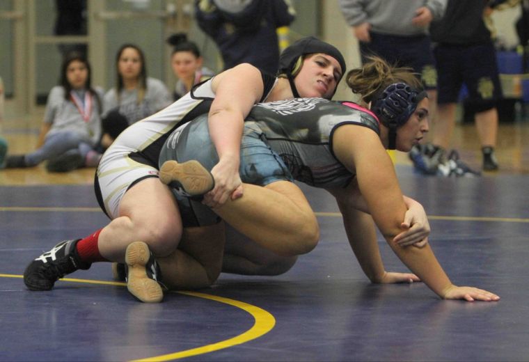 Local wrestlers win 7 district titles