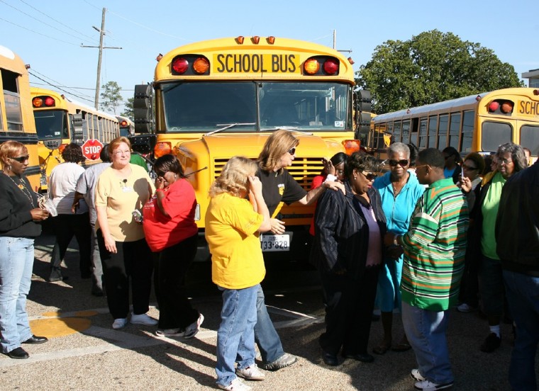 Conroe High bus drivers pay tribute Friday to one of their own