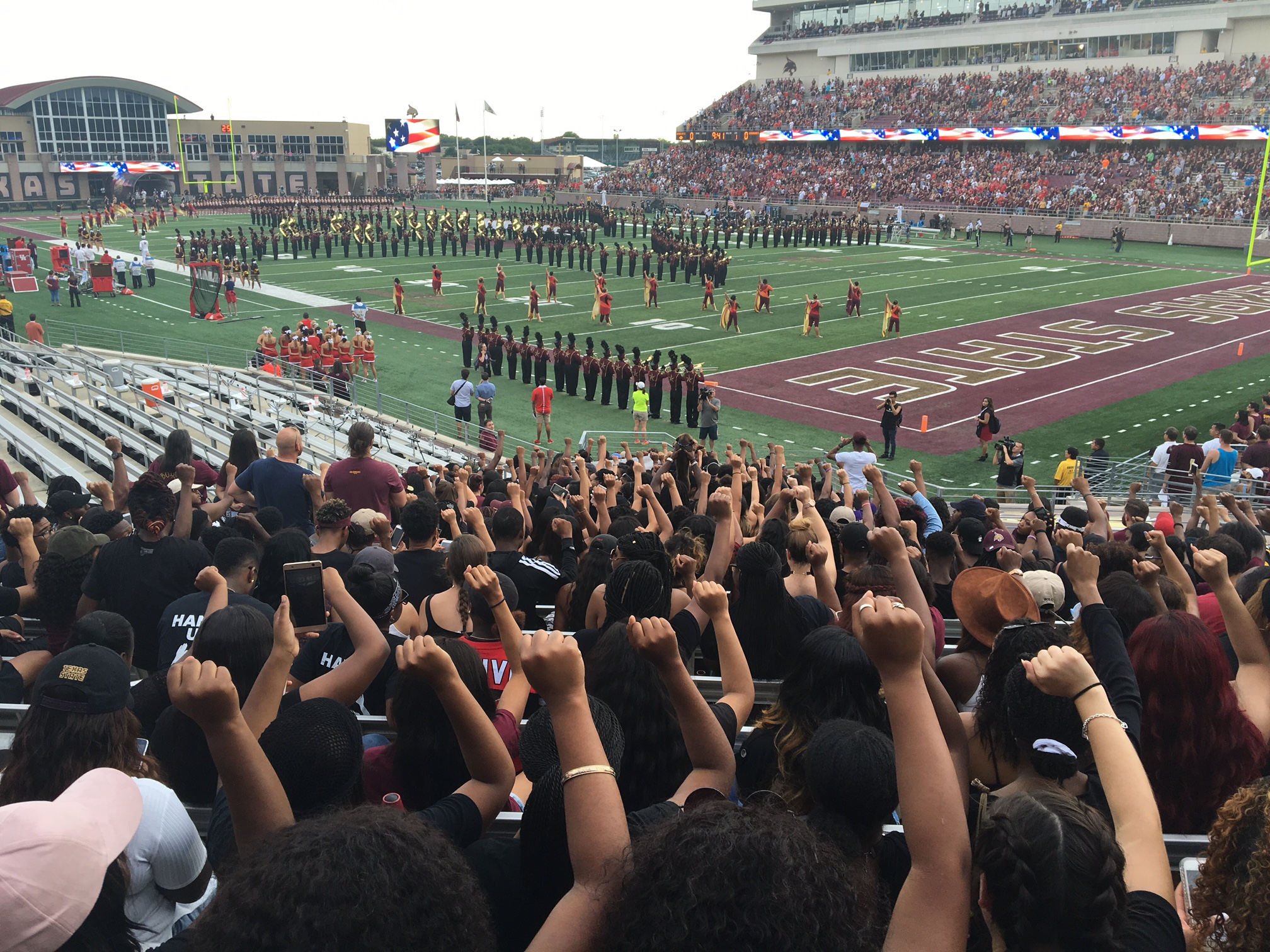 Texas State students sit-in during national anthem before UH game