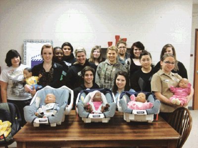 Magnolia High School students participate in parenting simulation