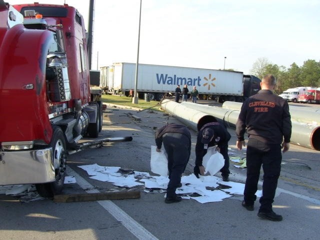 Overturned big rig crashes at busy intersection
