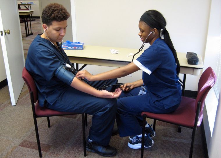 High school students graduate with CNA license