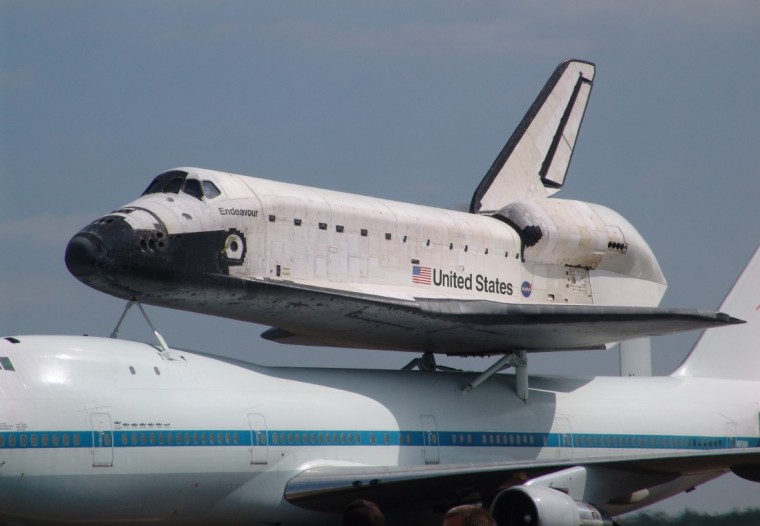 Crowds gather near NASA to see the shuttle fly over