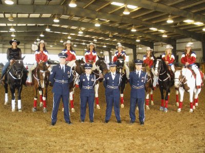 Riding team shows patriotic colors during armed forces rodeo