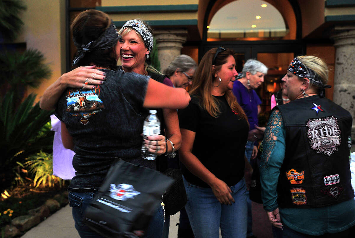 Women motorcyclists gather for a pre-rally meet and greet Thursday night