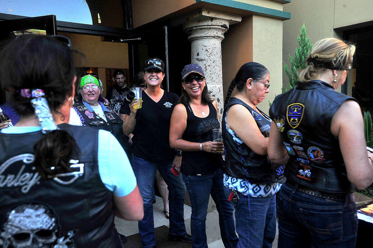 Women motorcyclists gather for a pre-rally meet and greet Thursday night