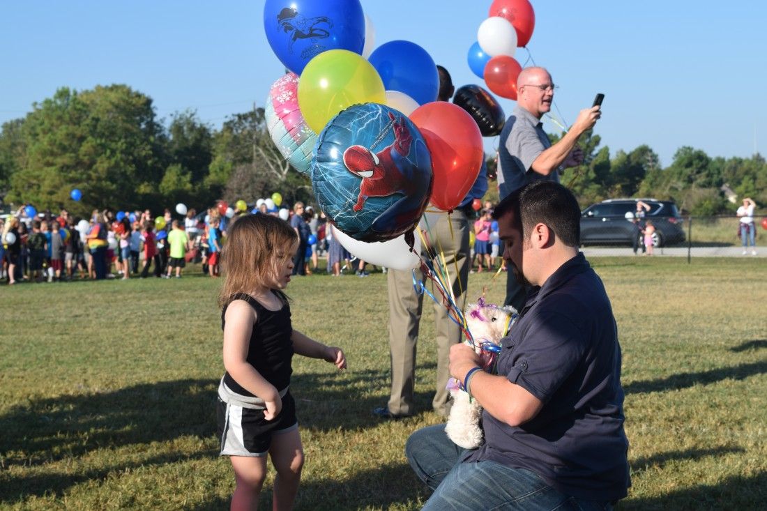 School releases balloons in honor of student