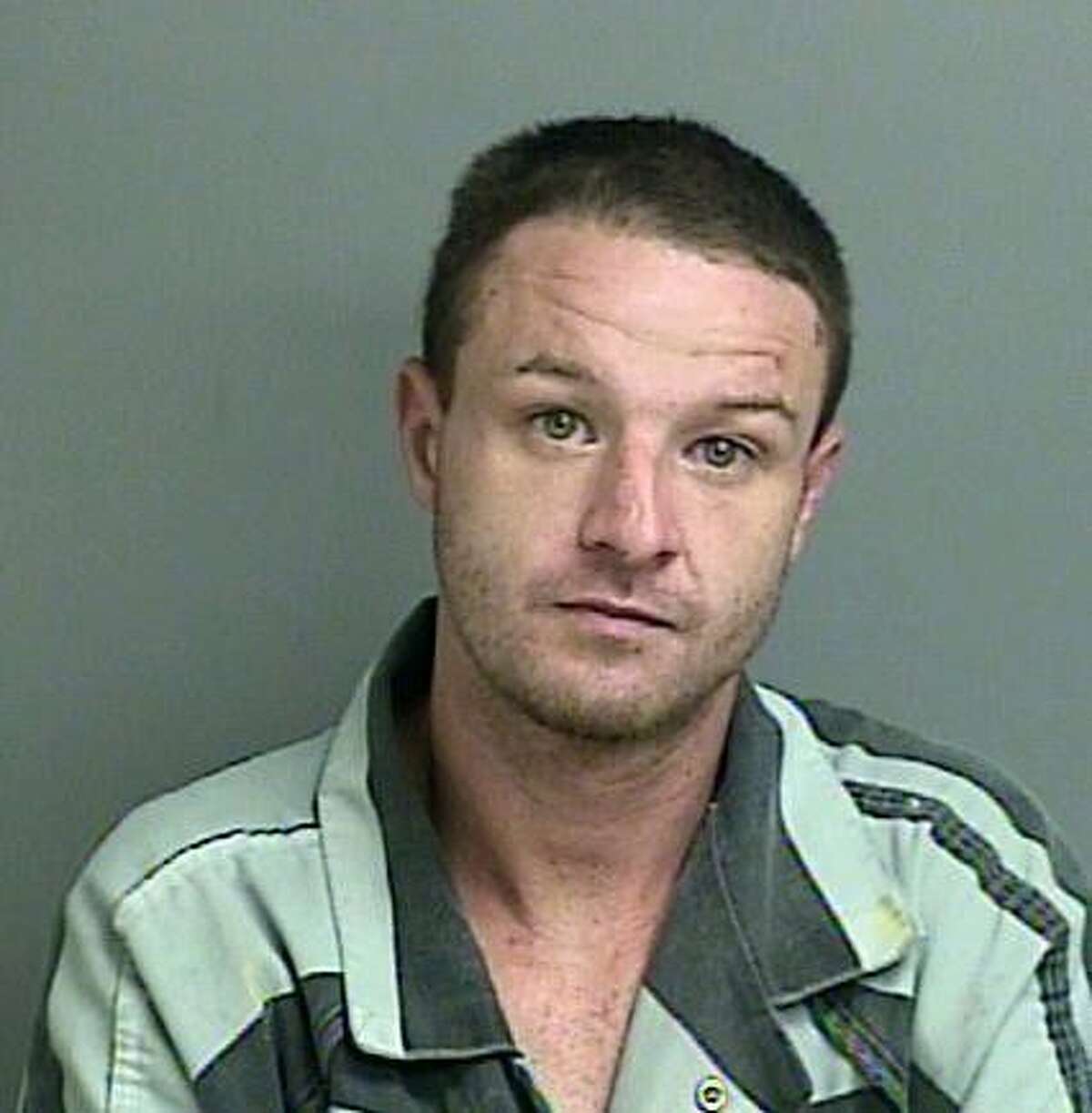 Spring man charged with burglary, retaliation against officer