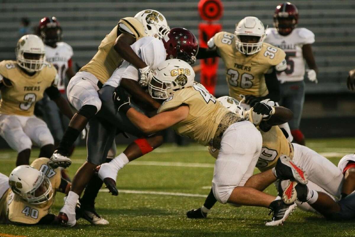 FOOTBALL: Conroe overcomes slow start, tops MacArthur