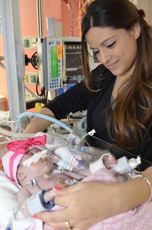 Baby born with heart outside her body makes history