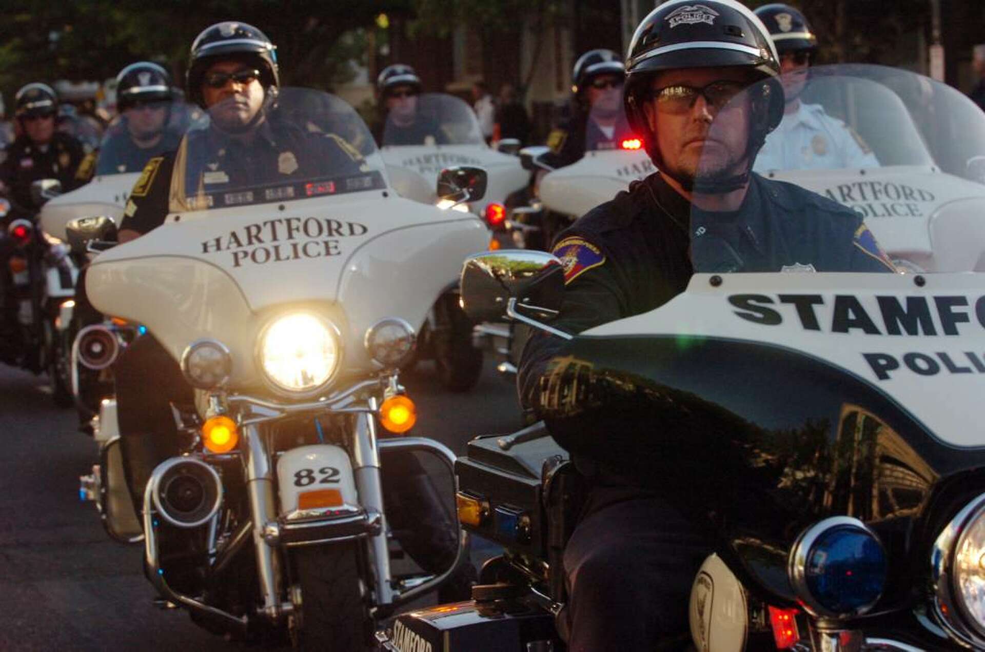 Stamford police parade turns streets blue and red