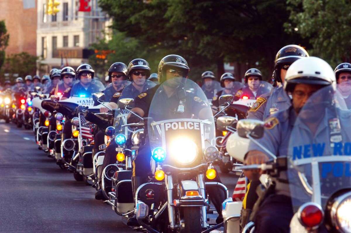 Stamford police parade turns streets blue and red