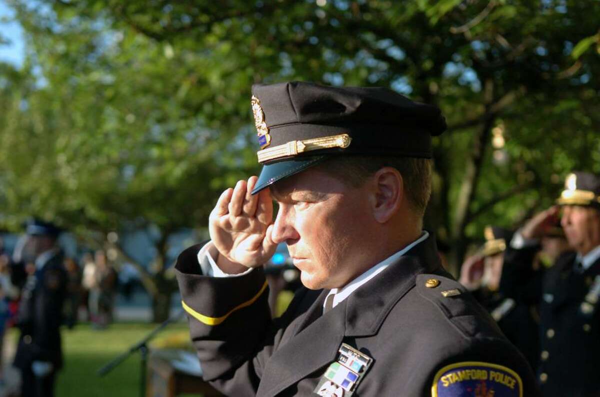 Stamford police parade turns streets blue and red