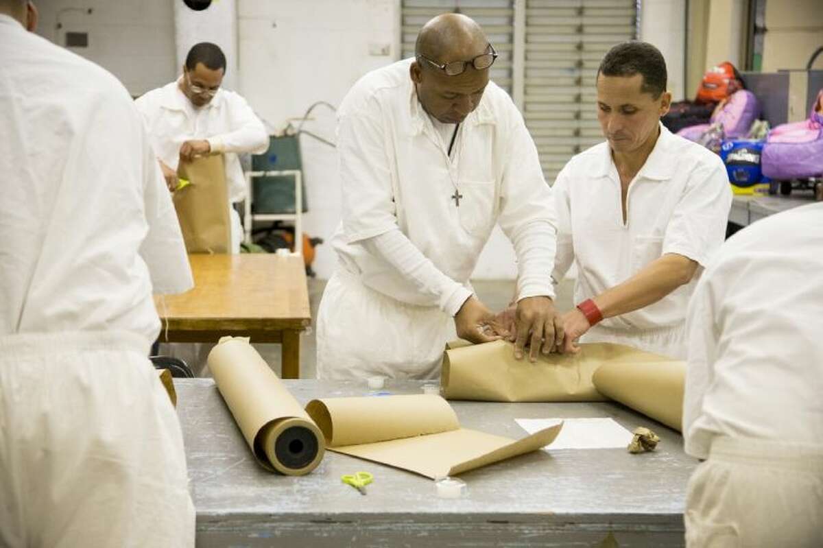 Inmates lend hands, talents to Christmas charity