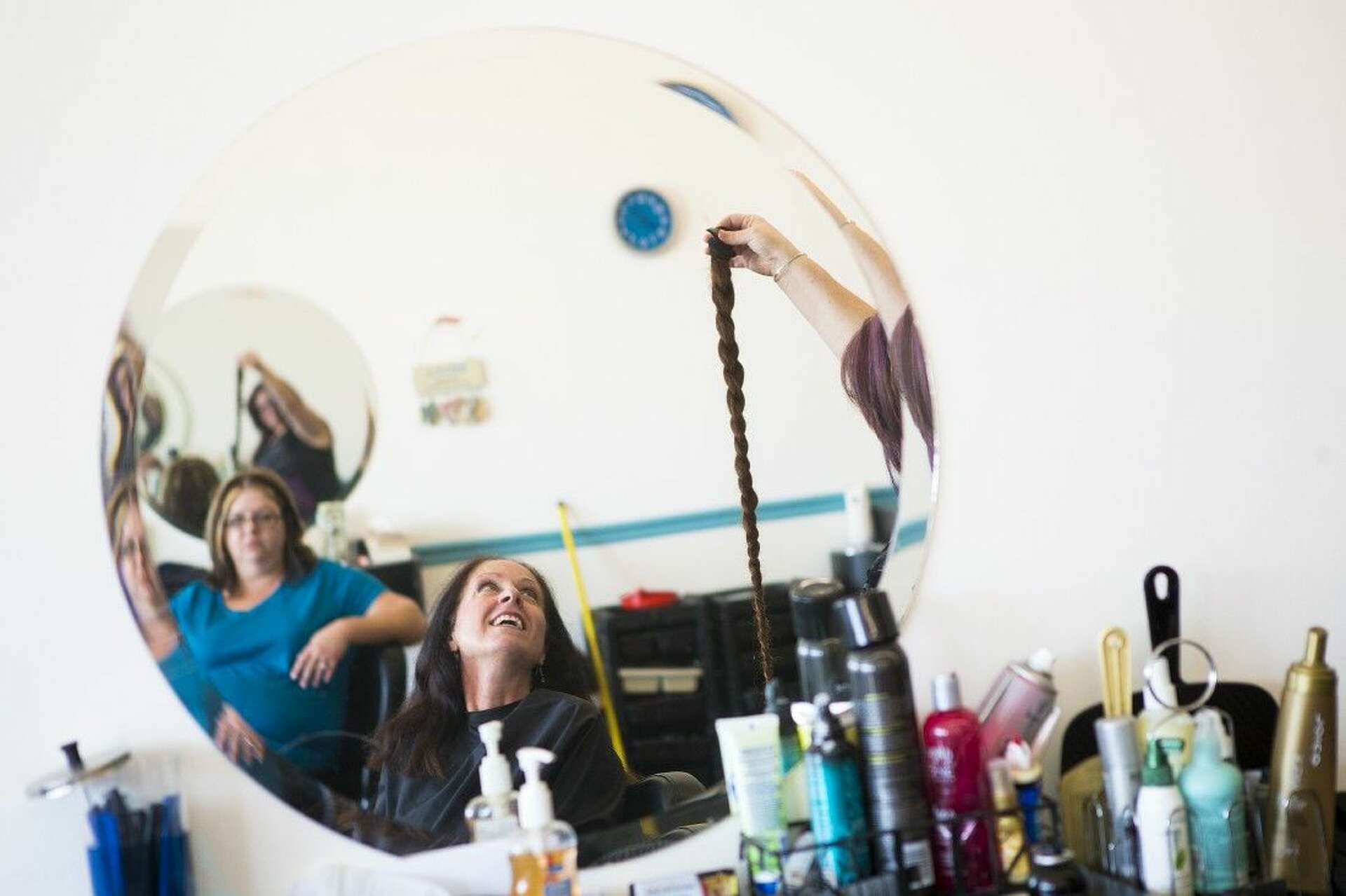 Woman donates nearly three feet of hair to cancer charity