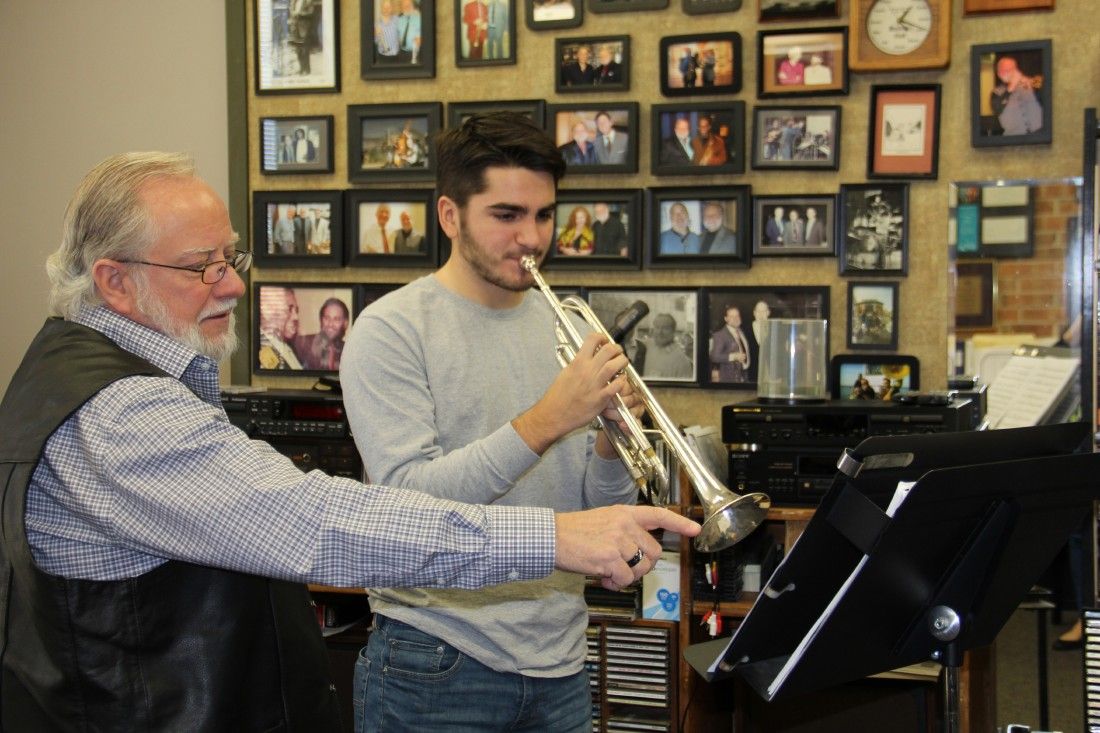 COM trumpeter makes state band