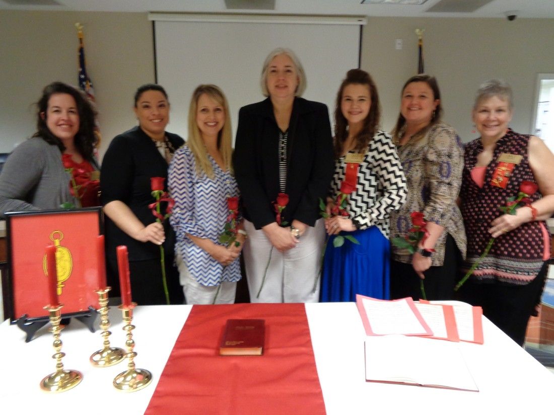 Mu Iota initiates four new members