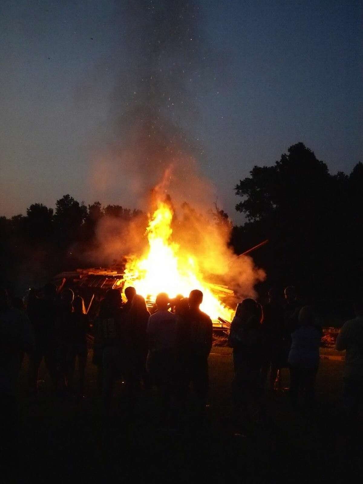 Liberty High School students rally around bonfire for homecoming